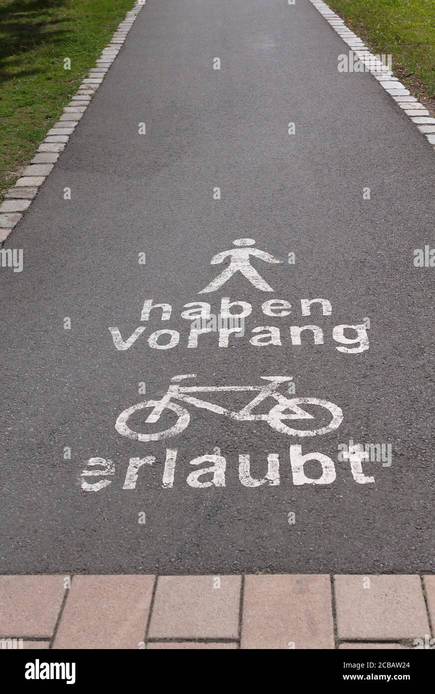 Pictogram, pedestrians have priority, cyclists allowed Stock Photo - Alamy