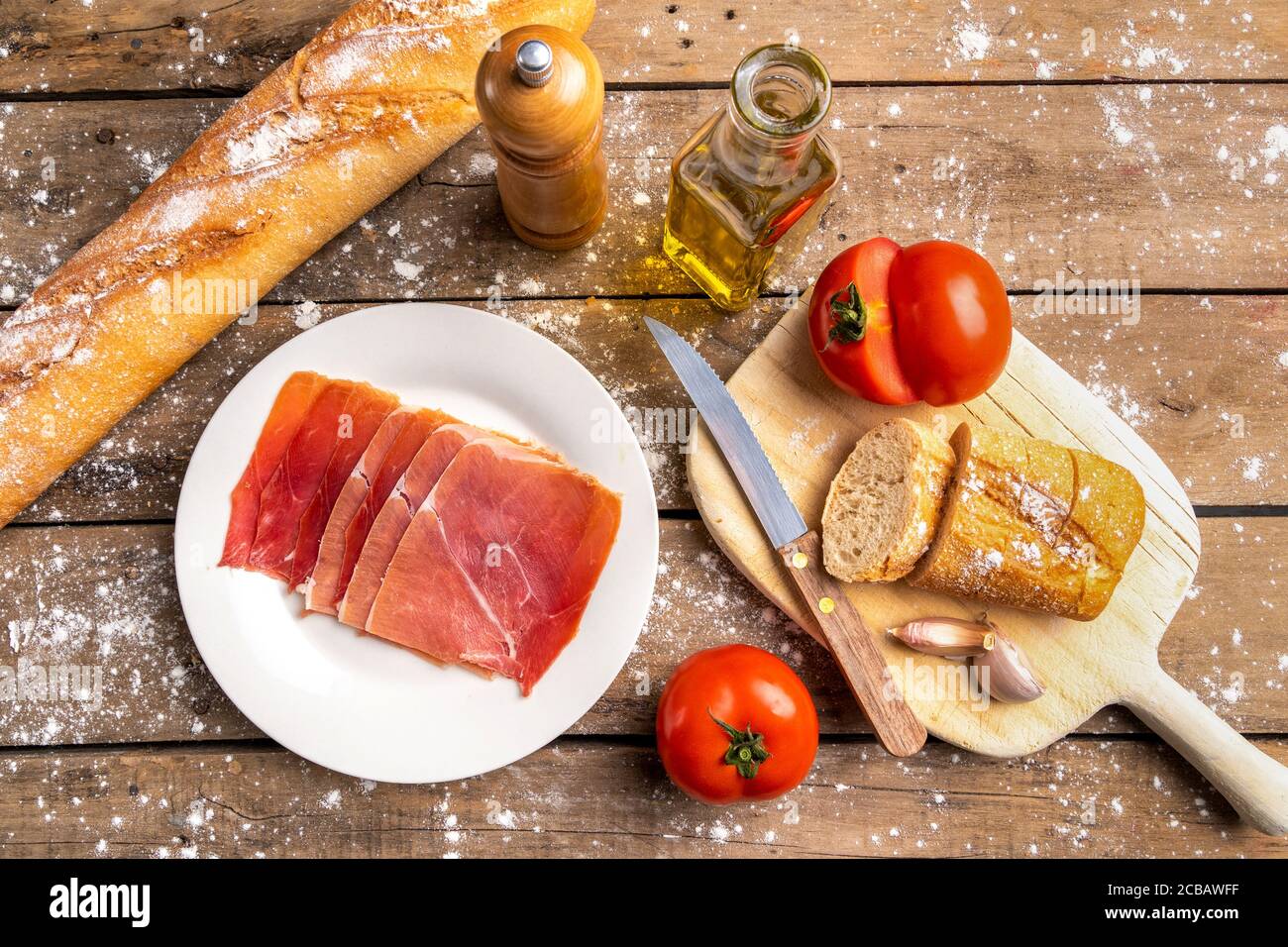 Overhead shot of snacks for lunch with bread and meat and tomatoes ...