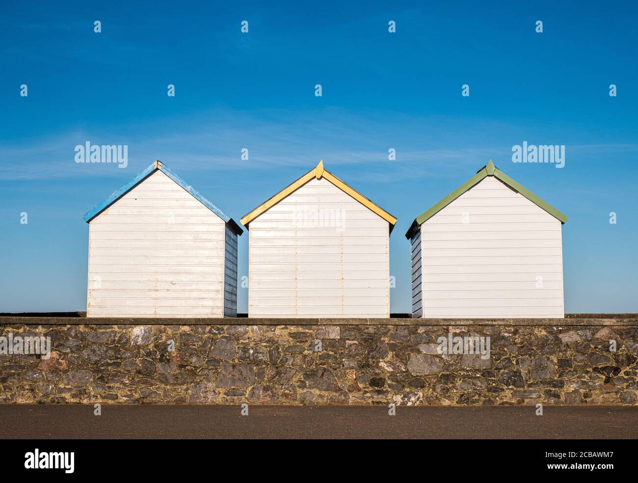 Rows of beach huts at sunset on Goodrington Sands, Devon Stock Photo ...