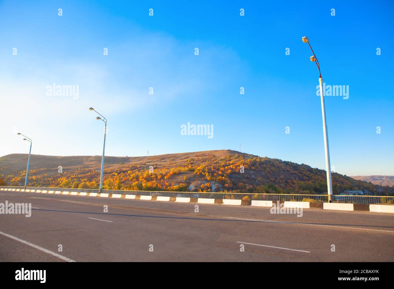 Empty highway . Electric poles along the road Stock Photo - Alamy