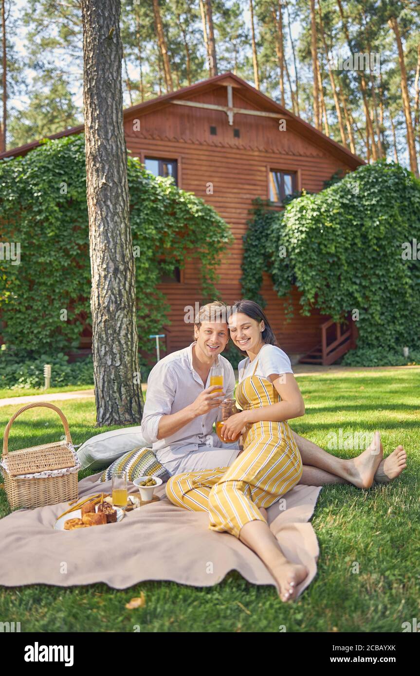 Cute couple resting together in the sunshine day Stock Photo - Alamy