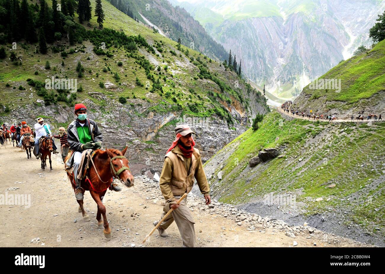Hindu devotees visit during their pilgrimage from Baltal Base Camp to ...
