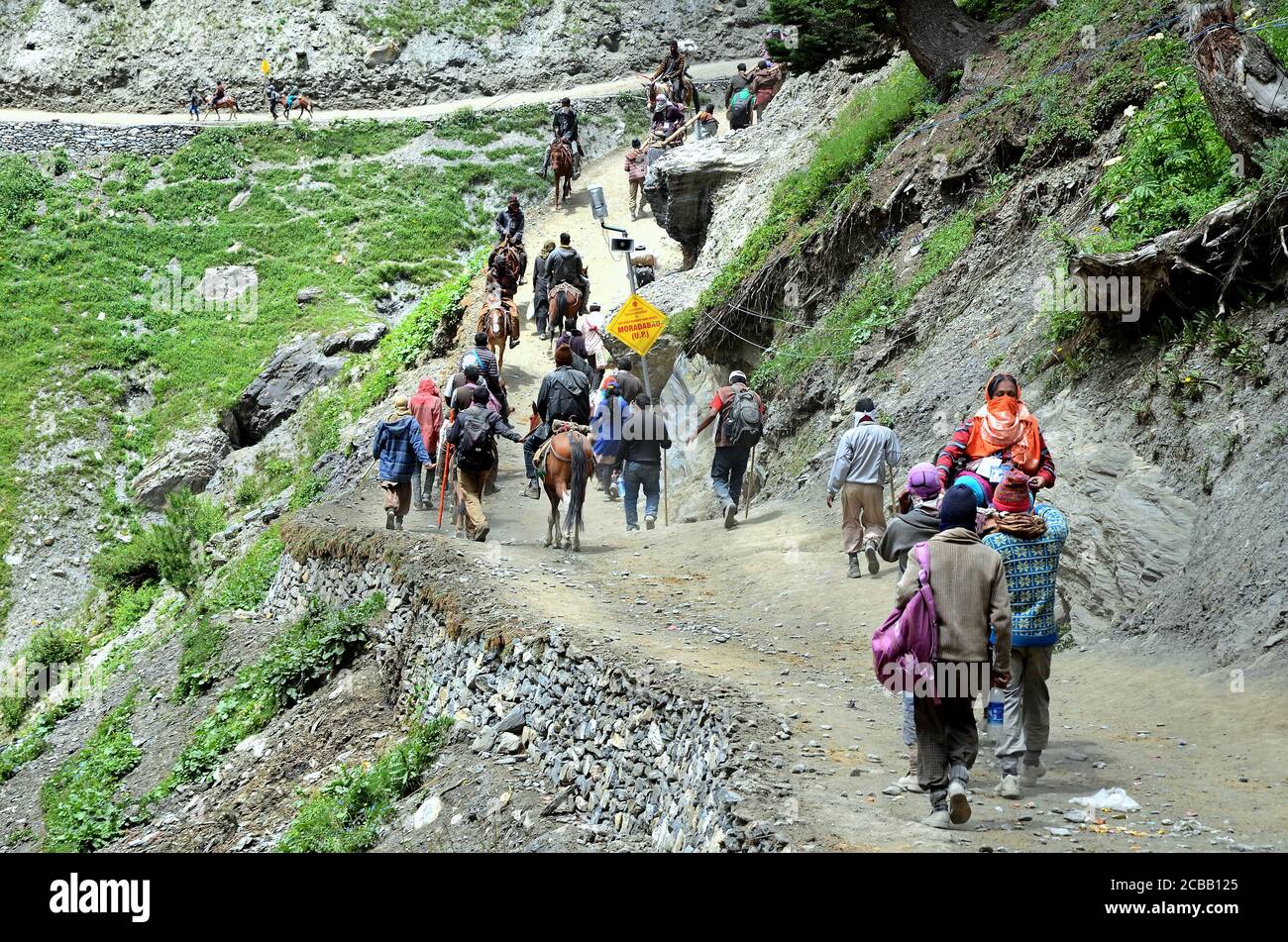 Hindu devotees visit during their pilgrimage from Baltal Base Camp to ...