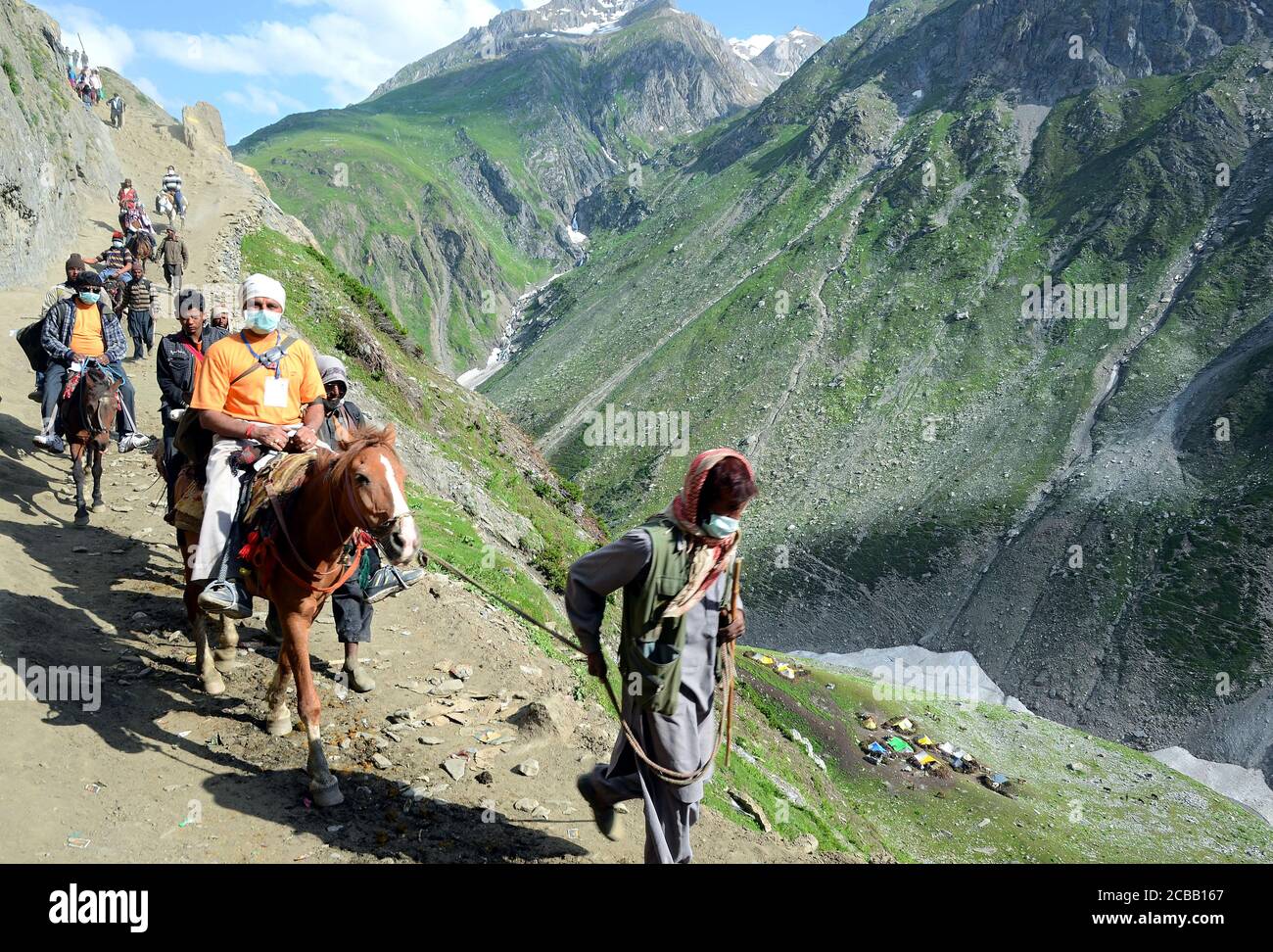 Hindu devotees visit during their pilgrimage from Baltal Base Camp to ...