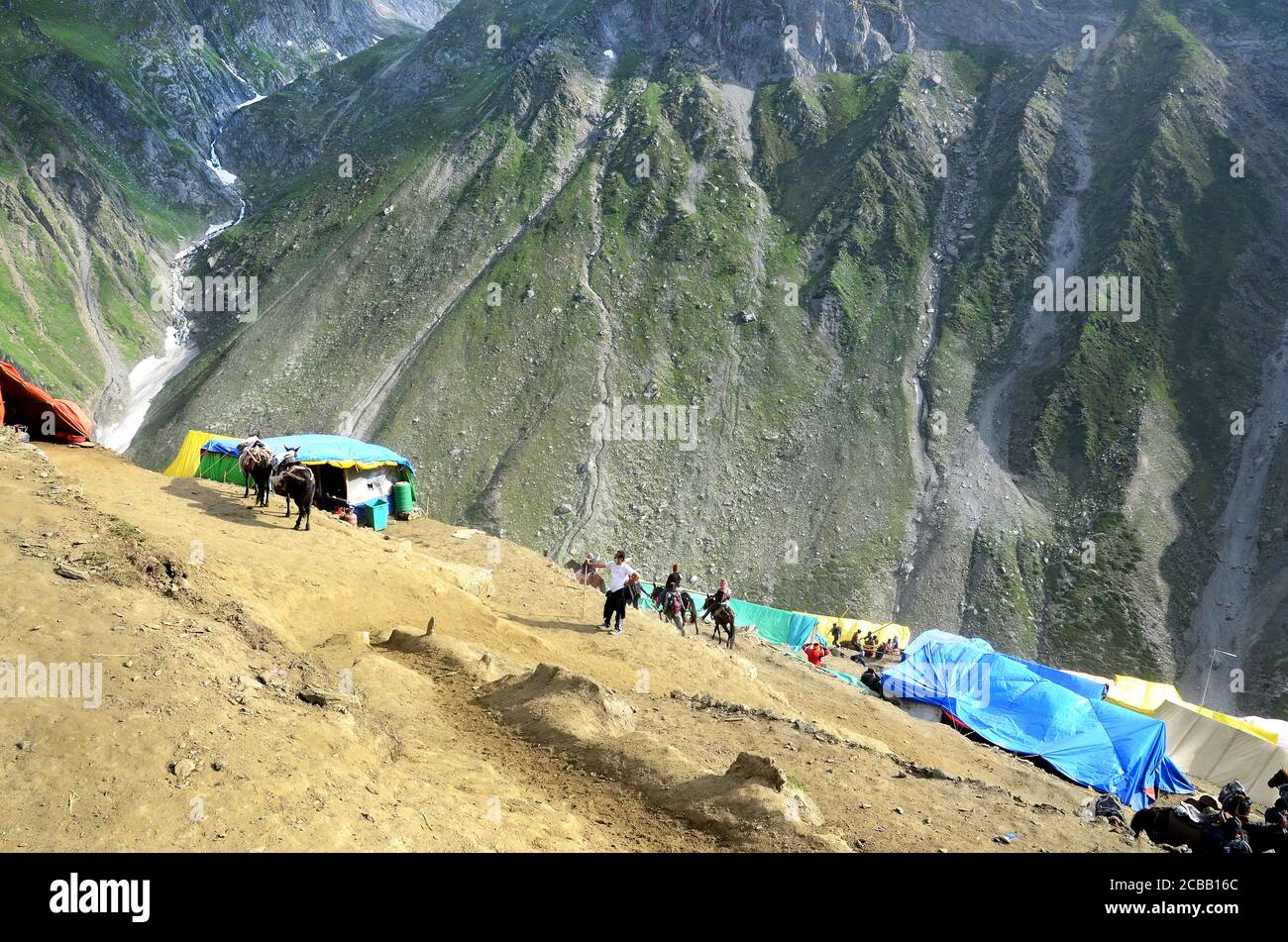 Hindu devotees visit during their pilgrimage from Baltal Base Camp to ...
