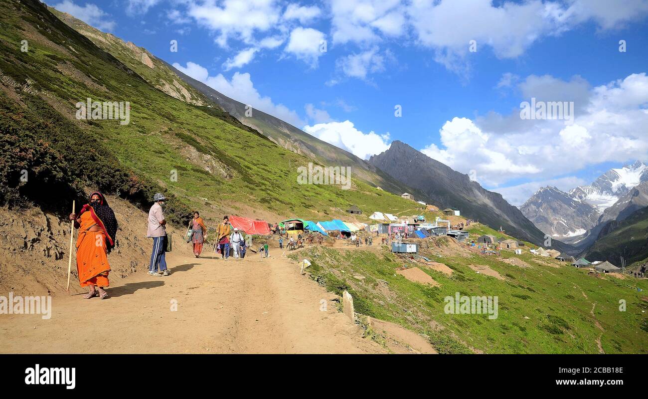 Hindu devotees visit during their pilgrimage from Baltal Base Camp to ...