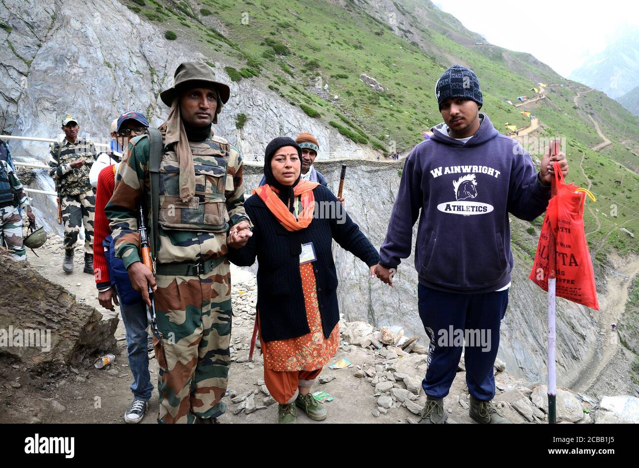 Hindu devotees visit during their pilgrimage from Baltal Base Camp to ...