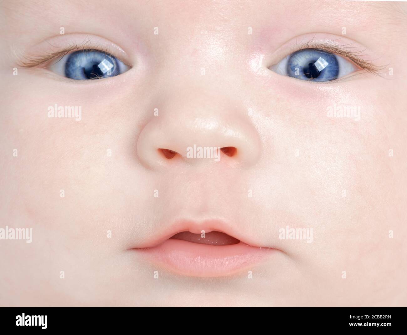 Baby newborn face new born kid face blue eyes closeup Stock Photo - Alamy