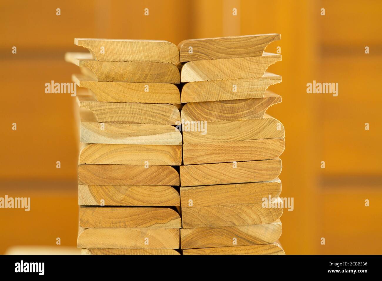Stack of cutted solid teak wood with wooden background Stock Photo - Alamy