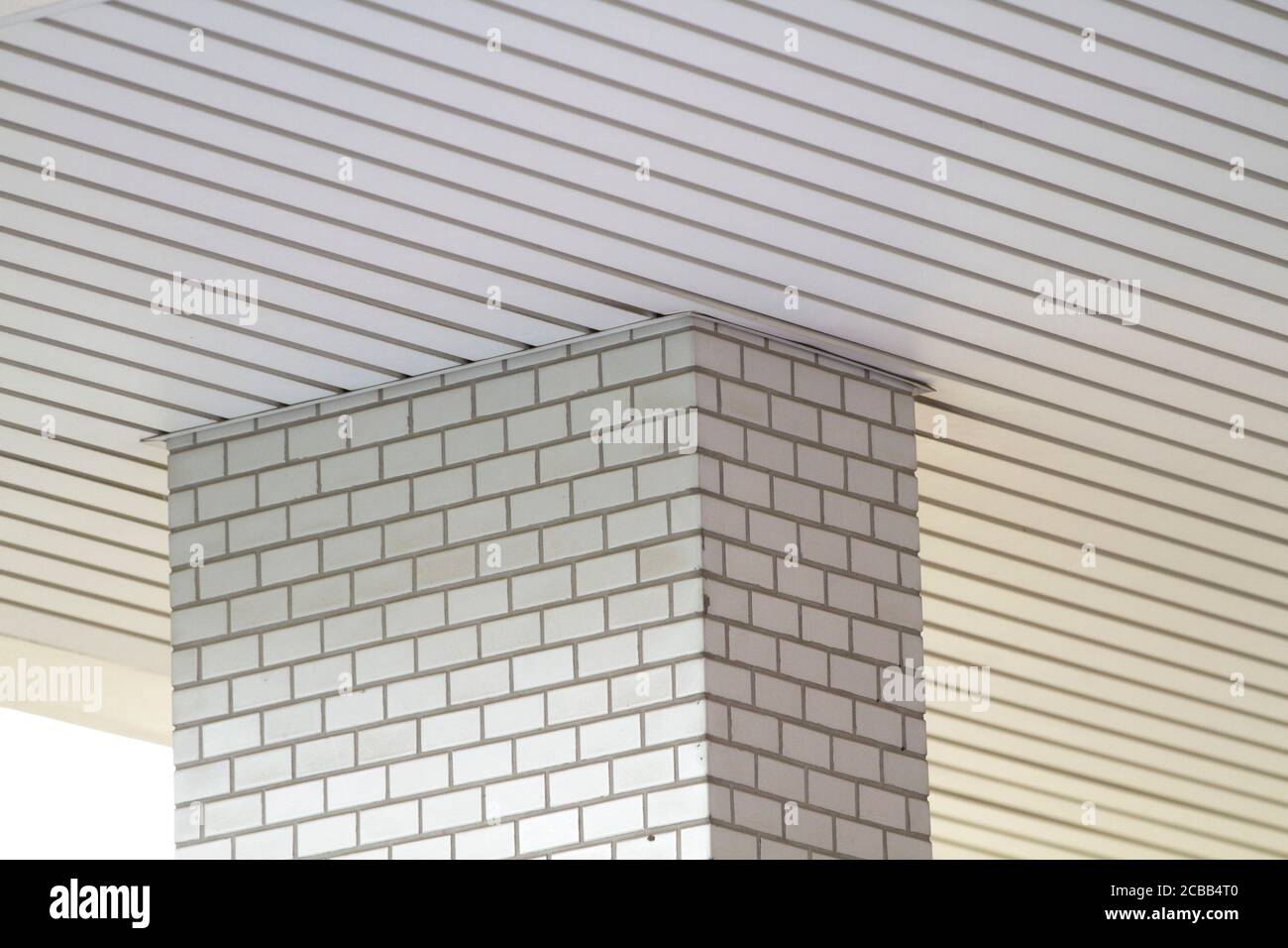 White tiled pattern and white ceiling pattern Stock Photo - Alamy