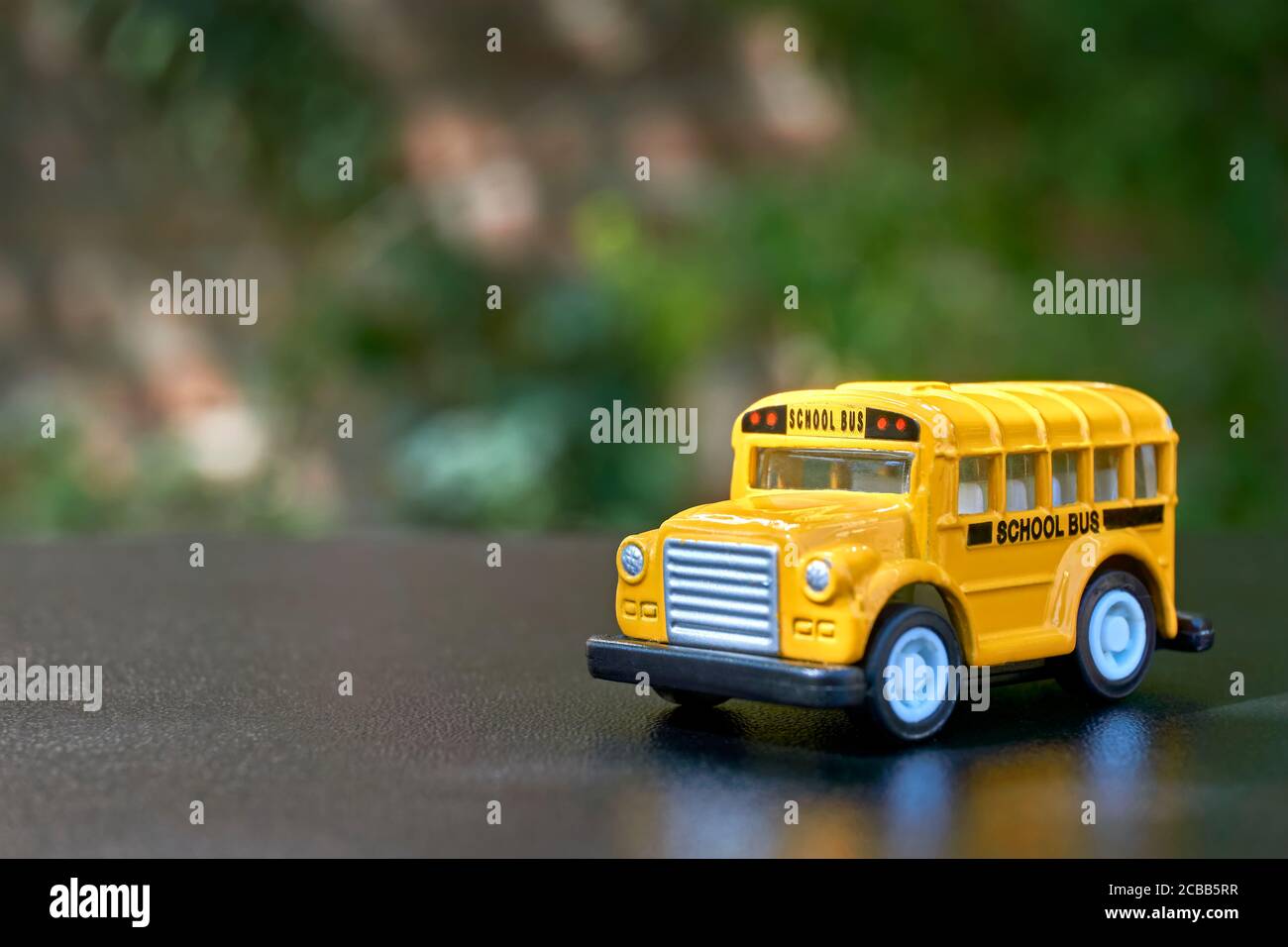 Yellow school bus toy model. Back to school concept. Image with ...