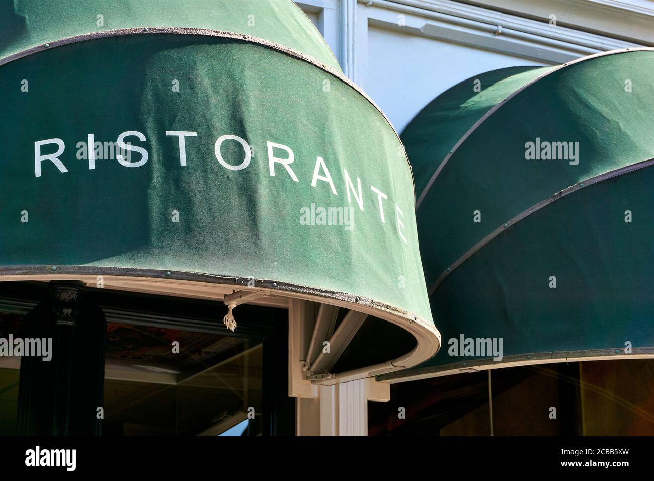 Closeup of green exterior window awnings outside an italian restaurant ...