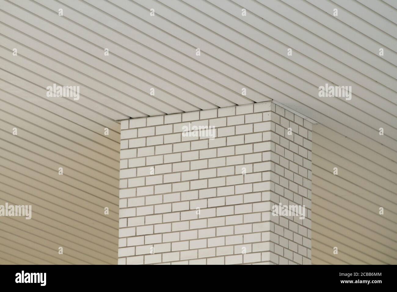 White tiled pattern and white ceiling pattern Stock Photo - Alamy