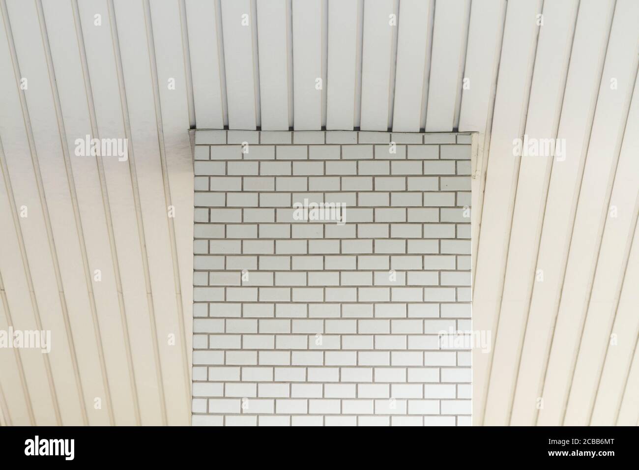 White tiled pattern and white ceiling pattern Stock Photo - Alamy
