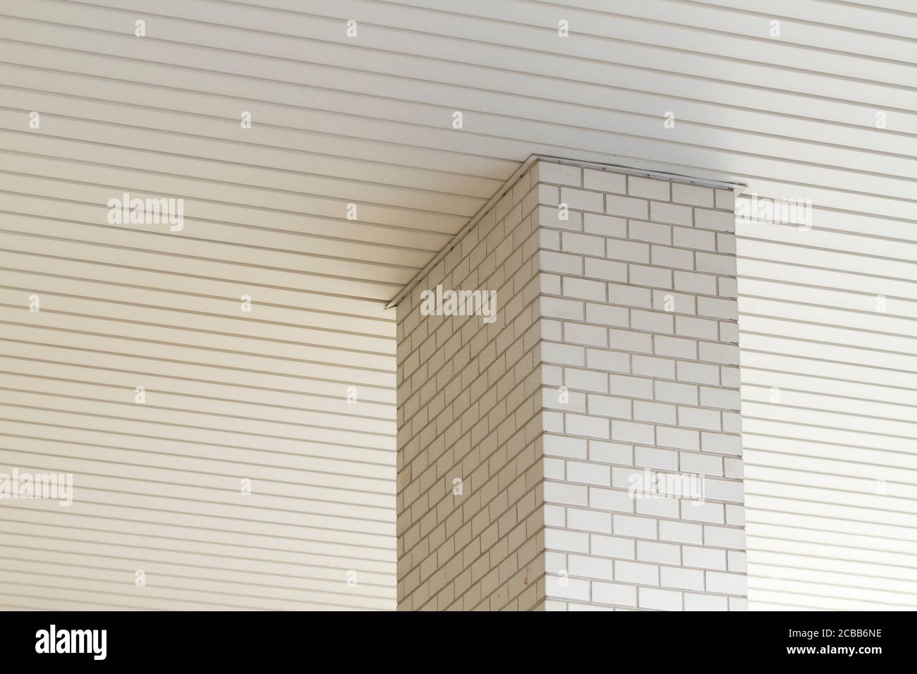 White tiled pattern and white ceiling pattern Stock Photo - Alamy