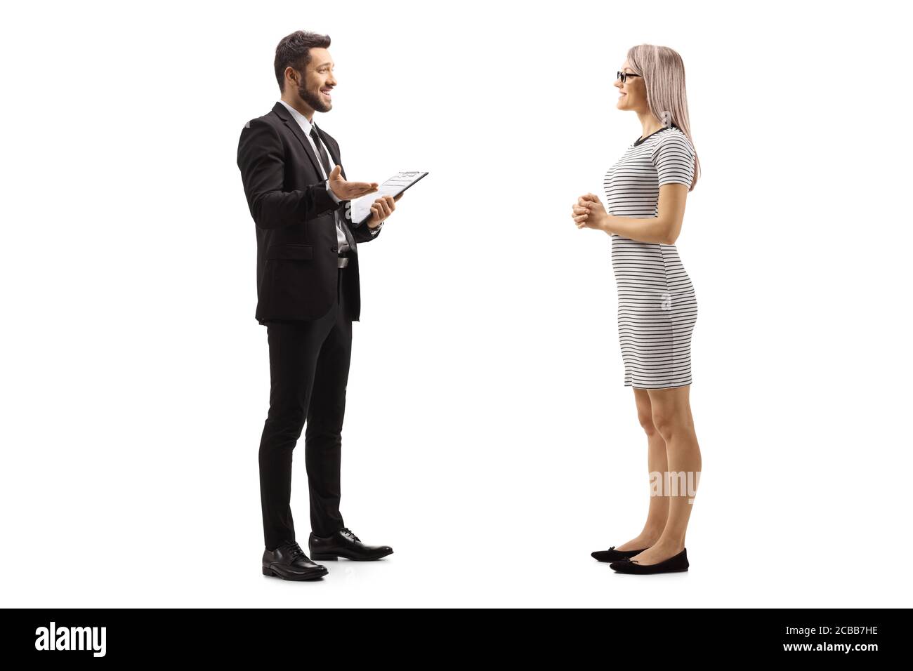 Full length profile shot of a man in a formal black suit and a woman in ...