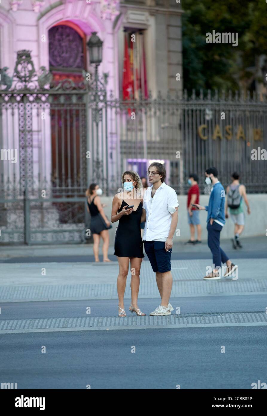Madrid, Spain - August 8, 2020: Tourists and walkers walk through the ...