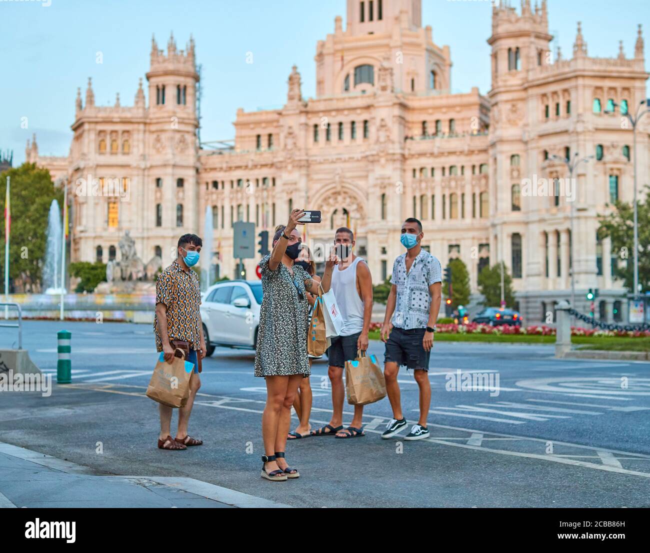 Madrid, Spain - August 8, 2020: Tourists and walkers walk through the ...