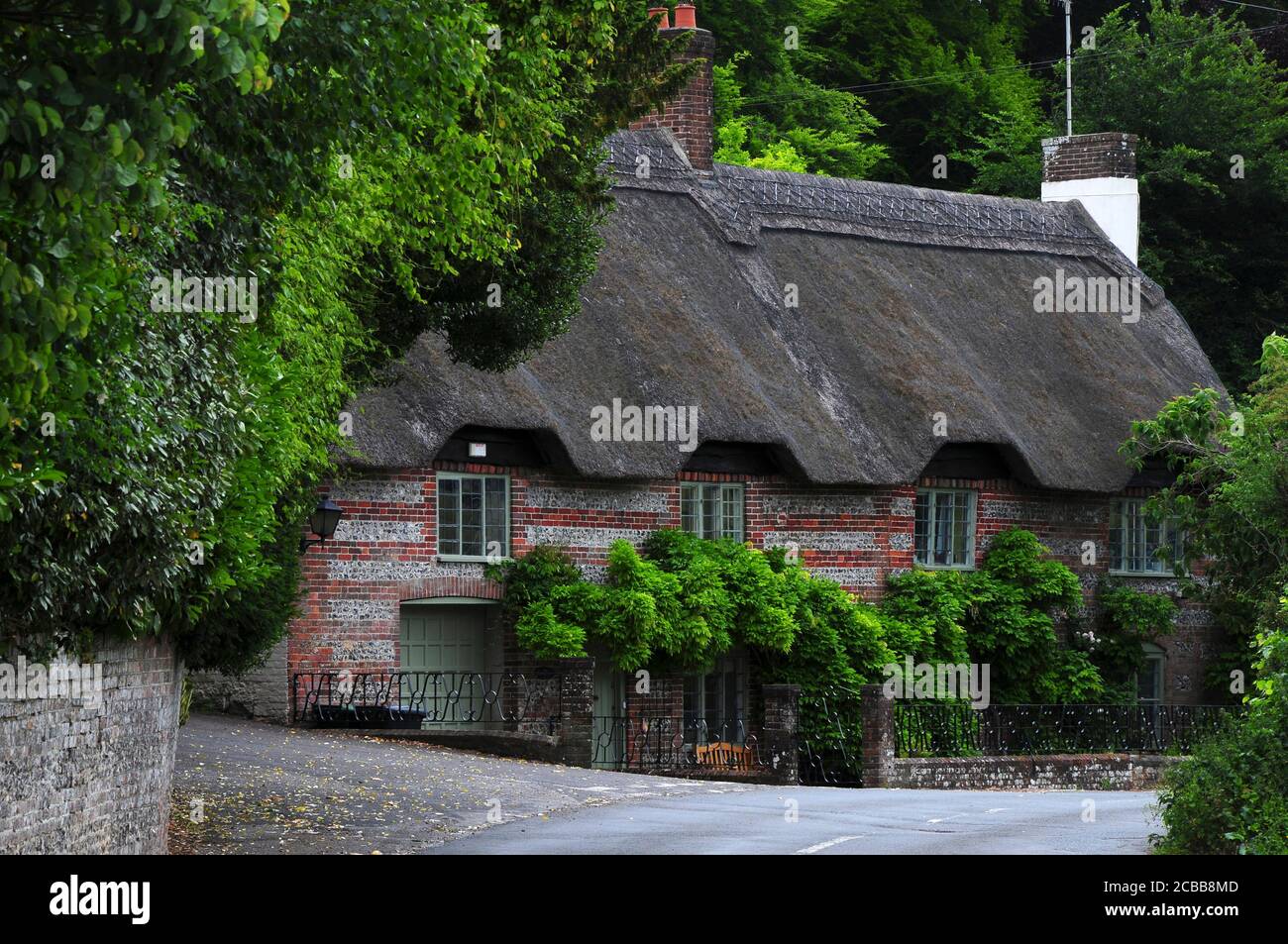 Thatched cottage in Winterborne Stickland village, Dorset, England ...