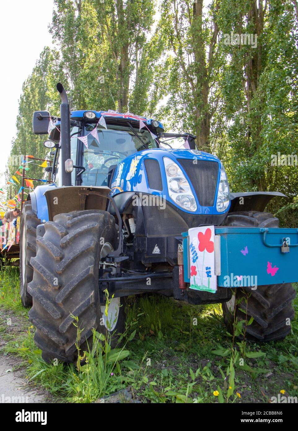 Decorated big blue tractor waiting for a parade to begin Stock Photo ...