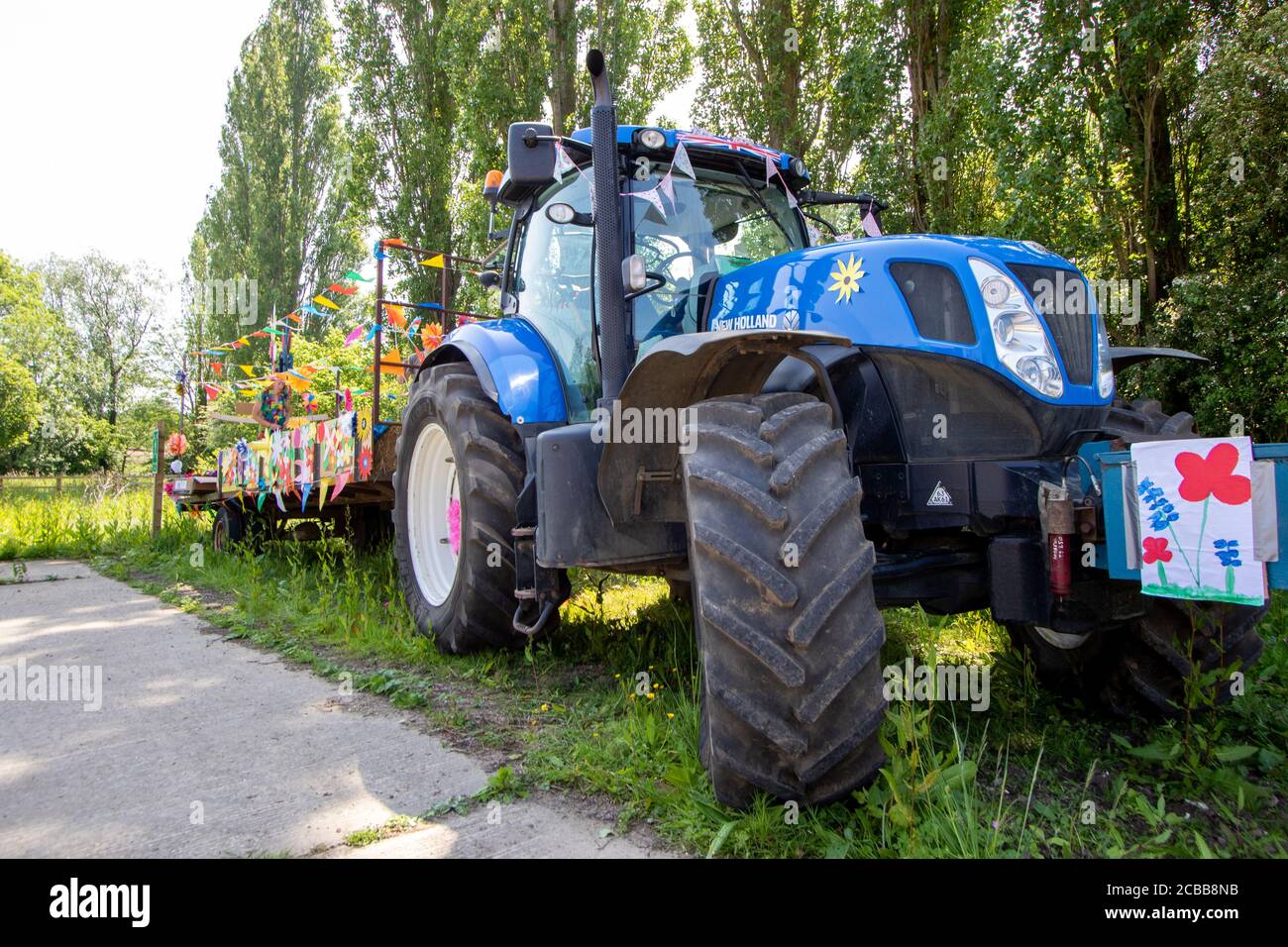Decorated big blue tractor waiting for a parade to begin Stock Photo ...