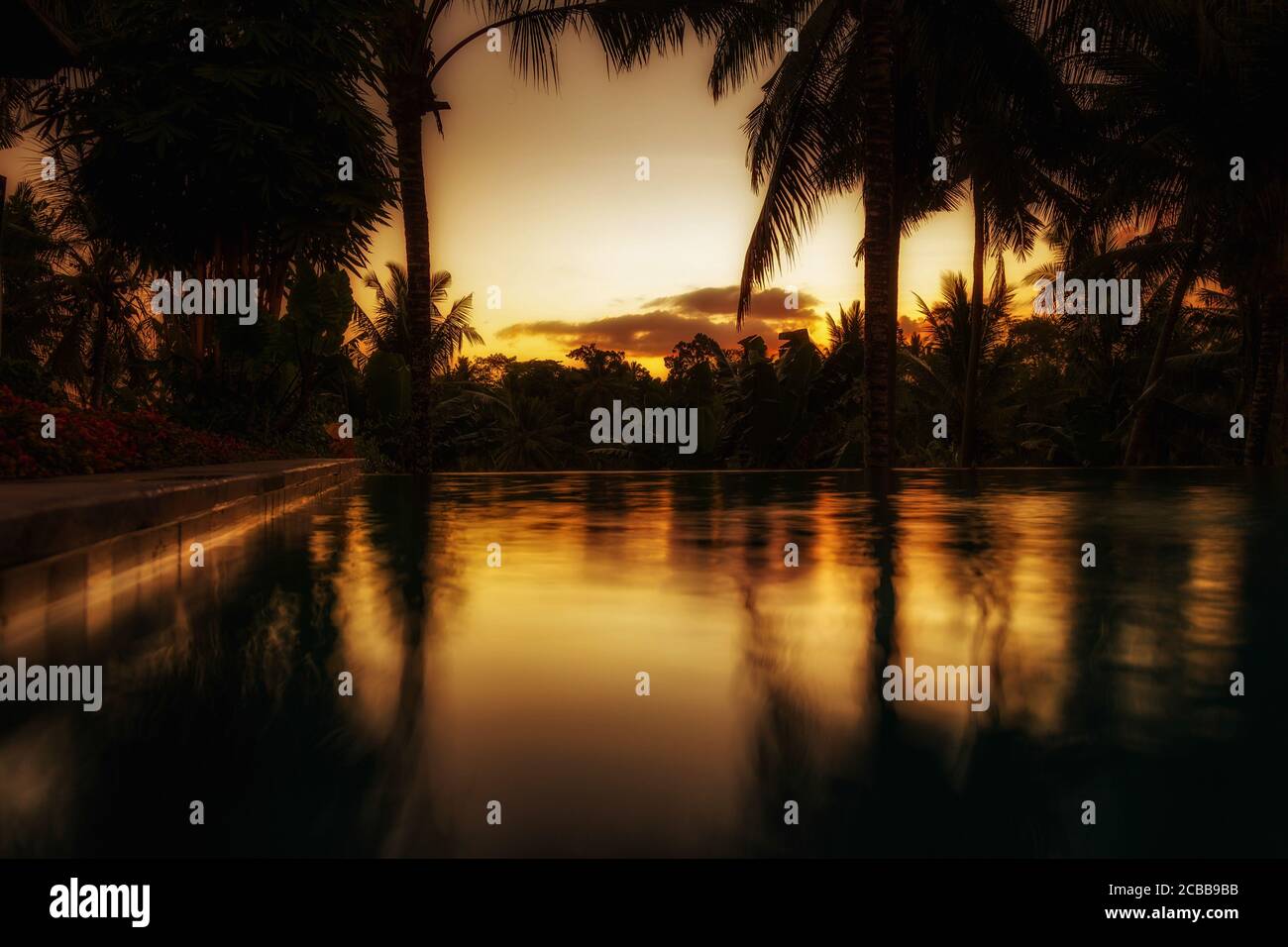 Beautiful sunset in a swimming pool Stock Photo - Alamy