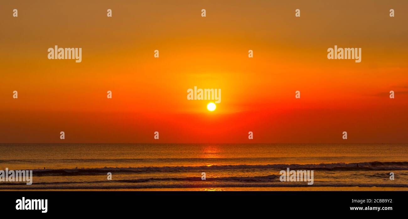 Bali beach with dramatic sky and sunset hi-res stock photography and ...