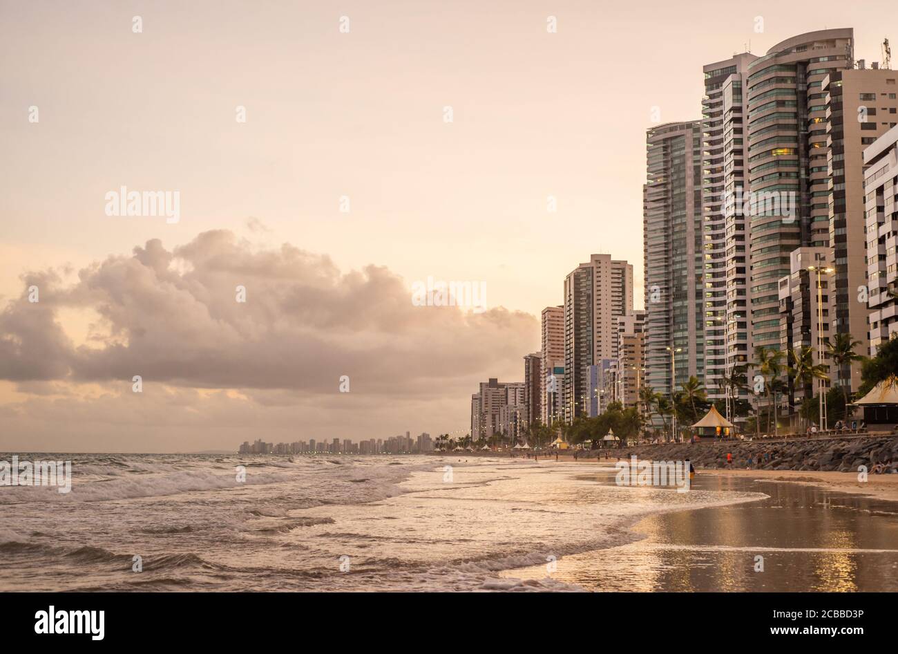 Modern waterfront buildings and beach at high tide in Recife, Brazil ...