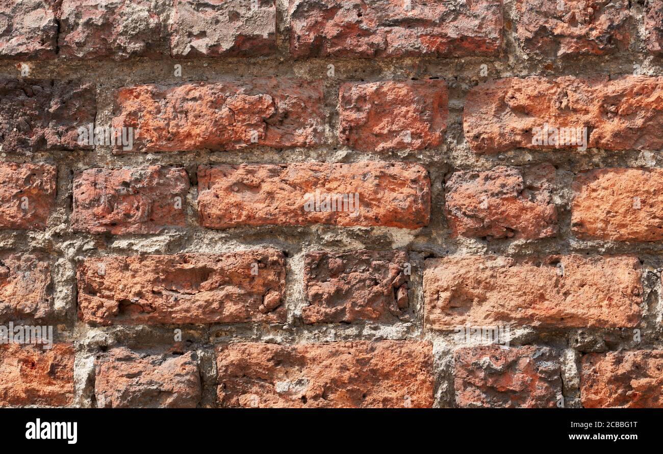 Background of old brick wall. Front view Stock Photo - Alamy