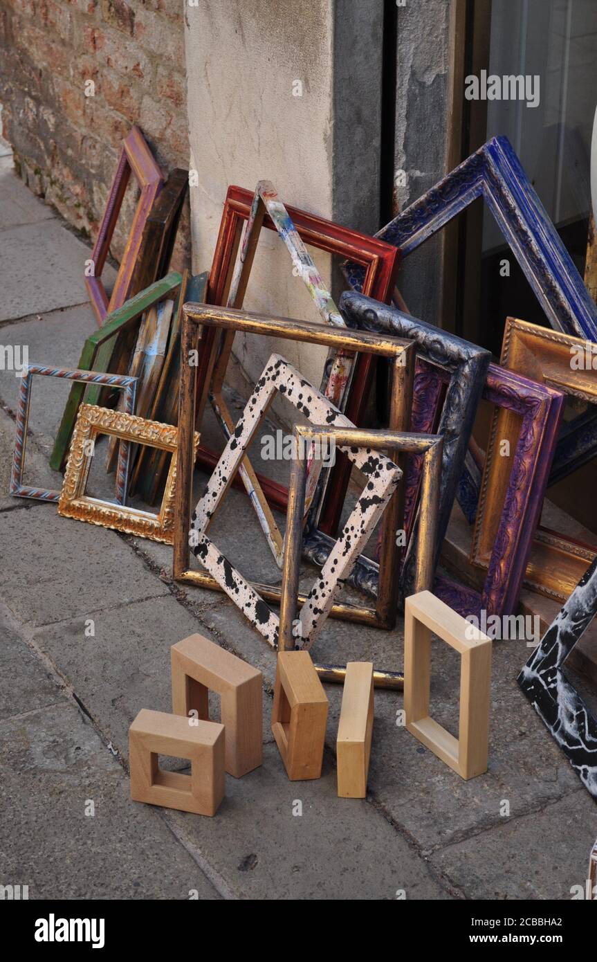 Vertical shot of different old frames on the ground at daylight Stock ...