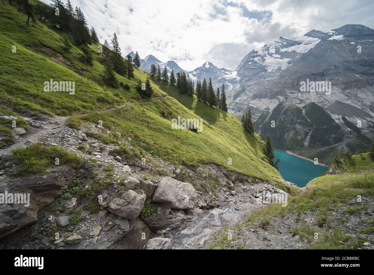 very nice hiking trail over lake oeschinen near kandersteg in ...