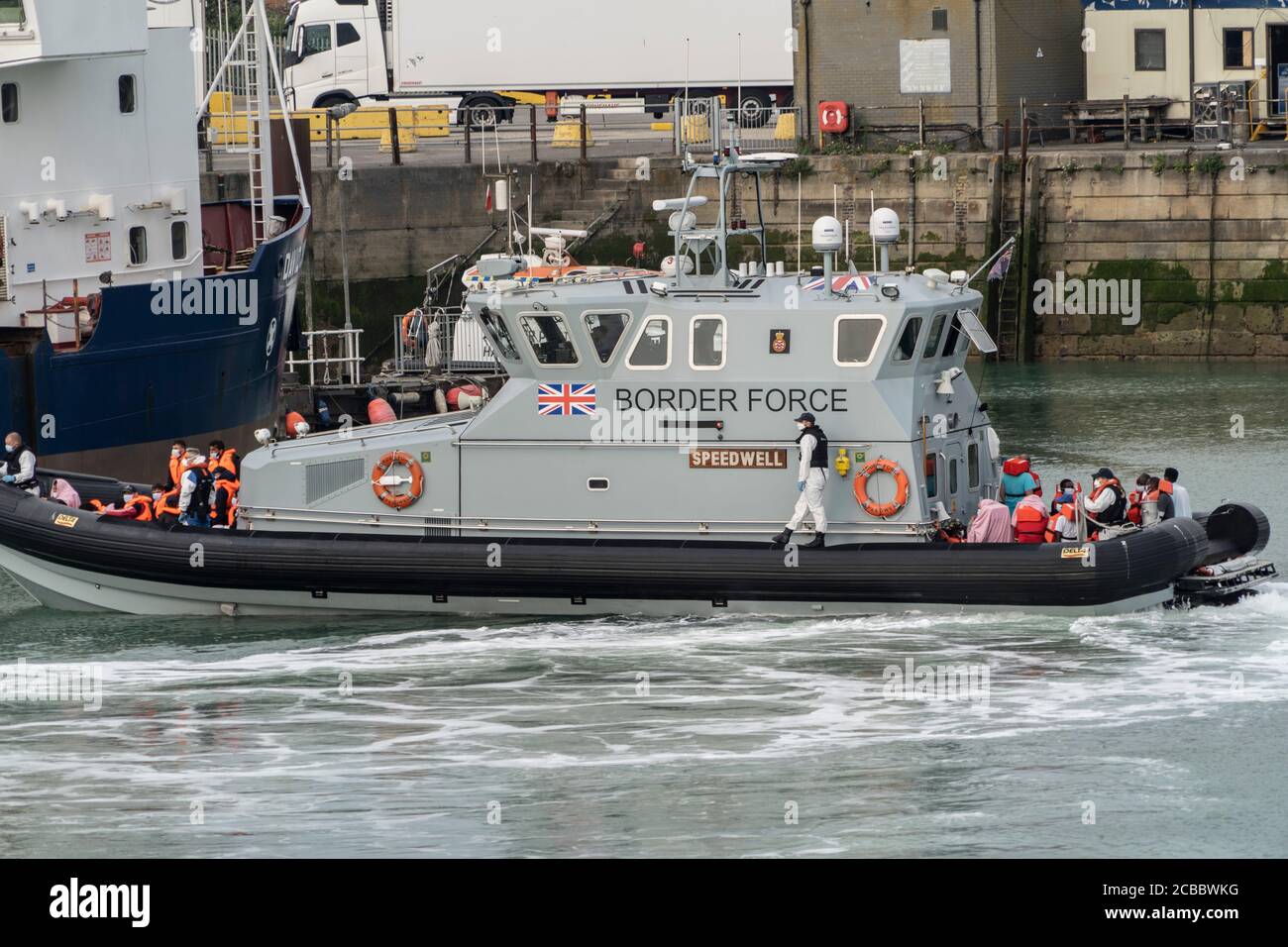 Migrants brought on shore by the border force at Dover port.Increasing ...