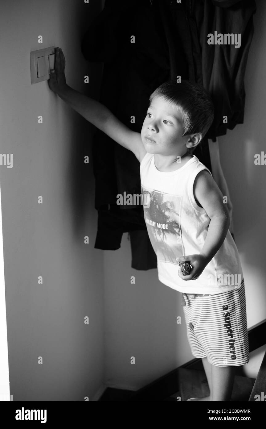 Child reaching light switch hi-res stock photography and images - Alamy
