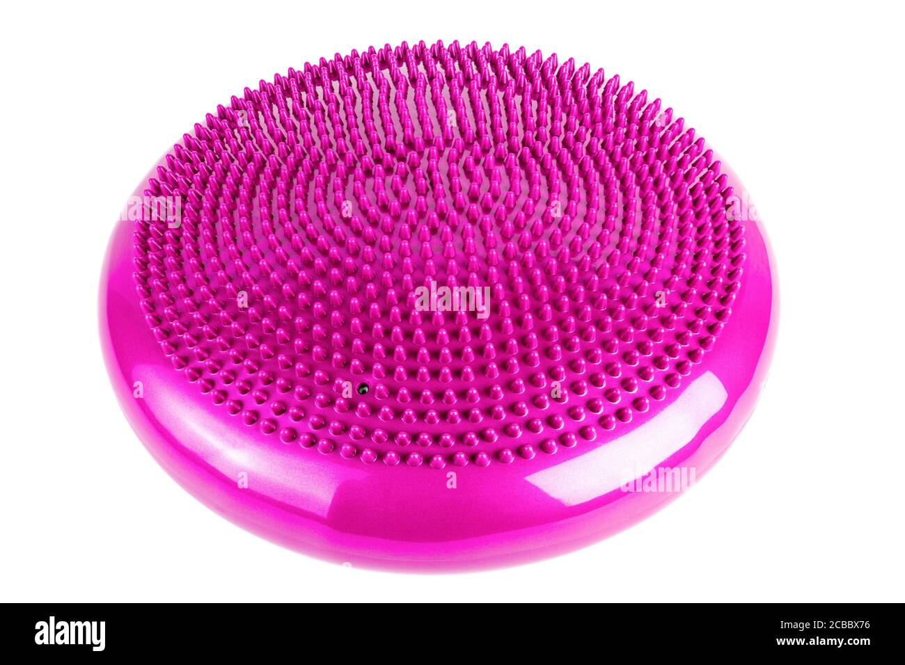Pink inflatable balance disk isoleated on white background, It is also ...