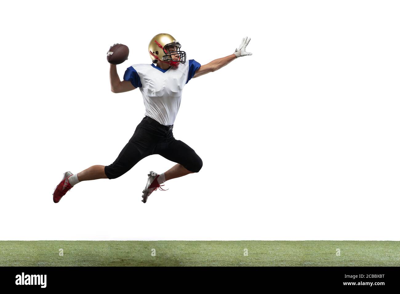In jump, flight. American football player isolated on white studio ...
