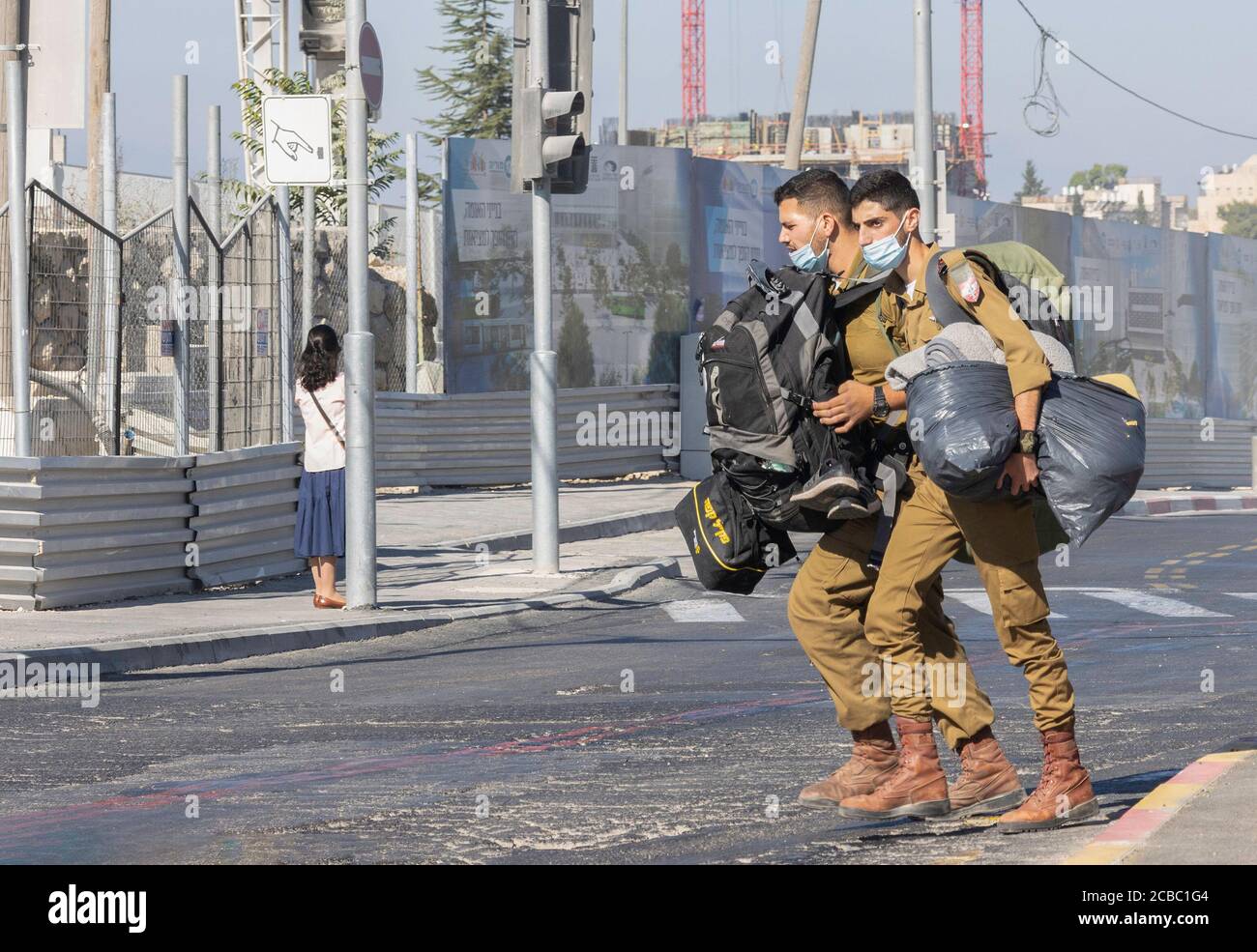 Jerusalem, Israel - August 6th, 2020: Two israeli soldiers, carrying a ...