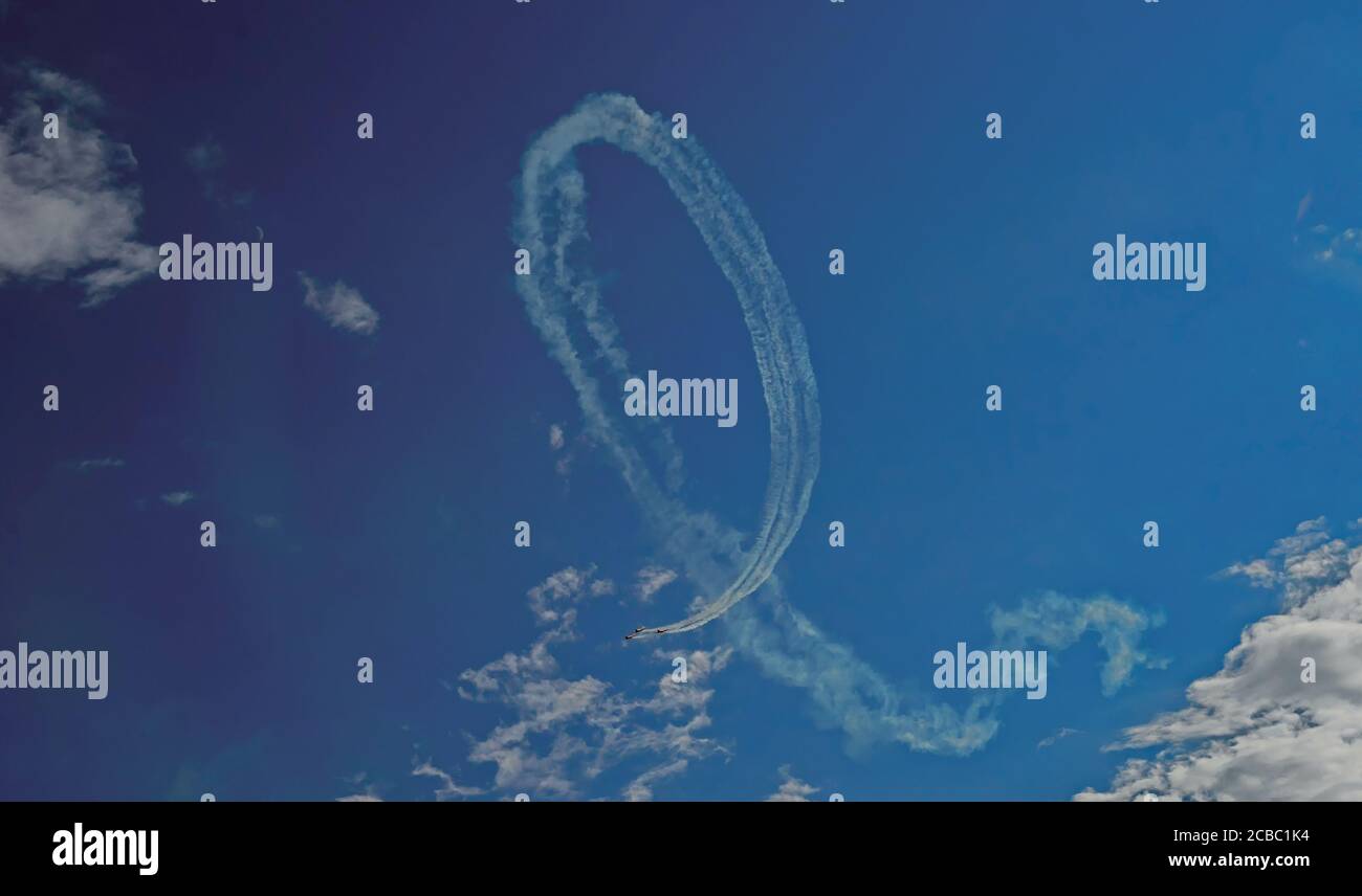 Inversion trail of the plane. A small plane makes a dead loop Stock ...