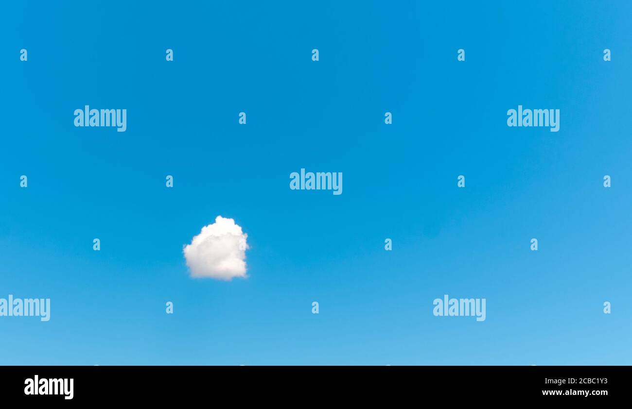 one white cloud on blue sky abstract background Stock Photo - Alamy
