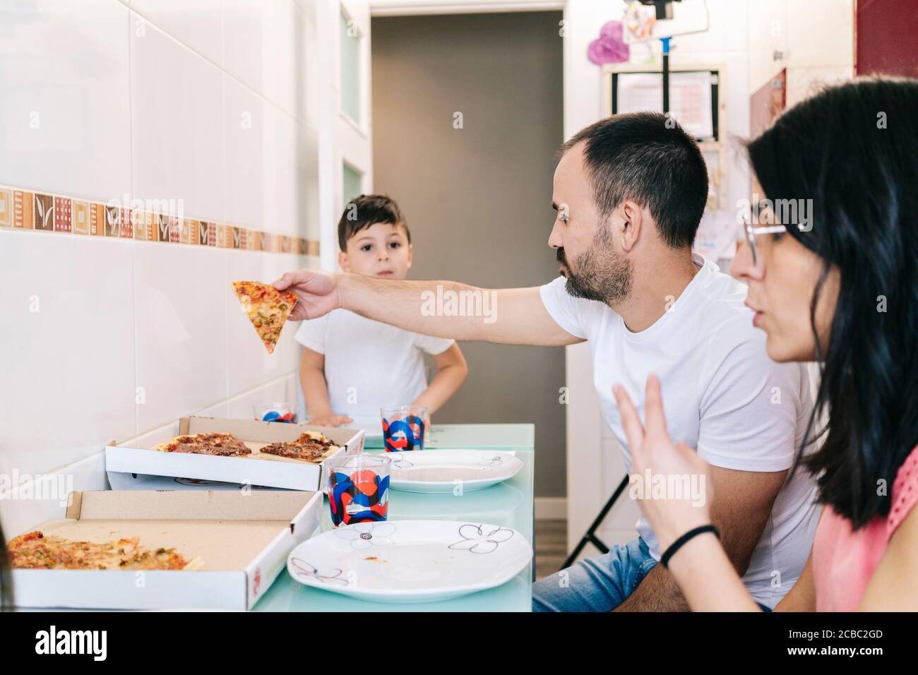 Children sharing a pizza together hi-res stock photography and images ...