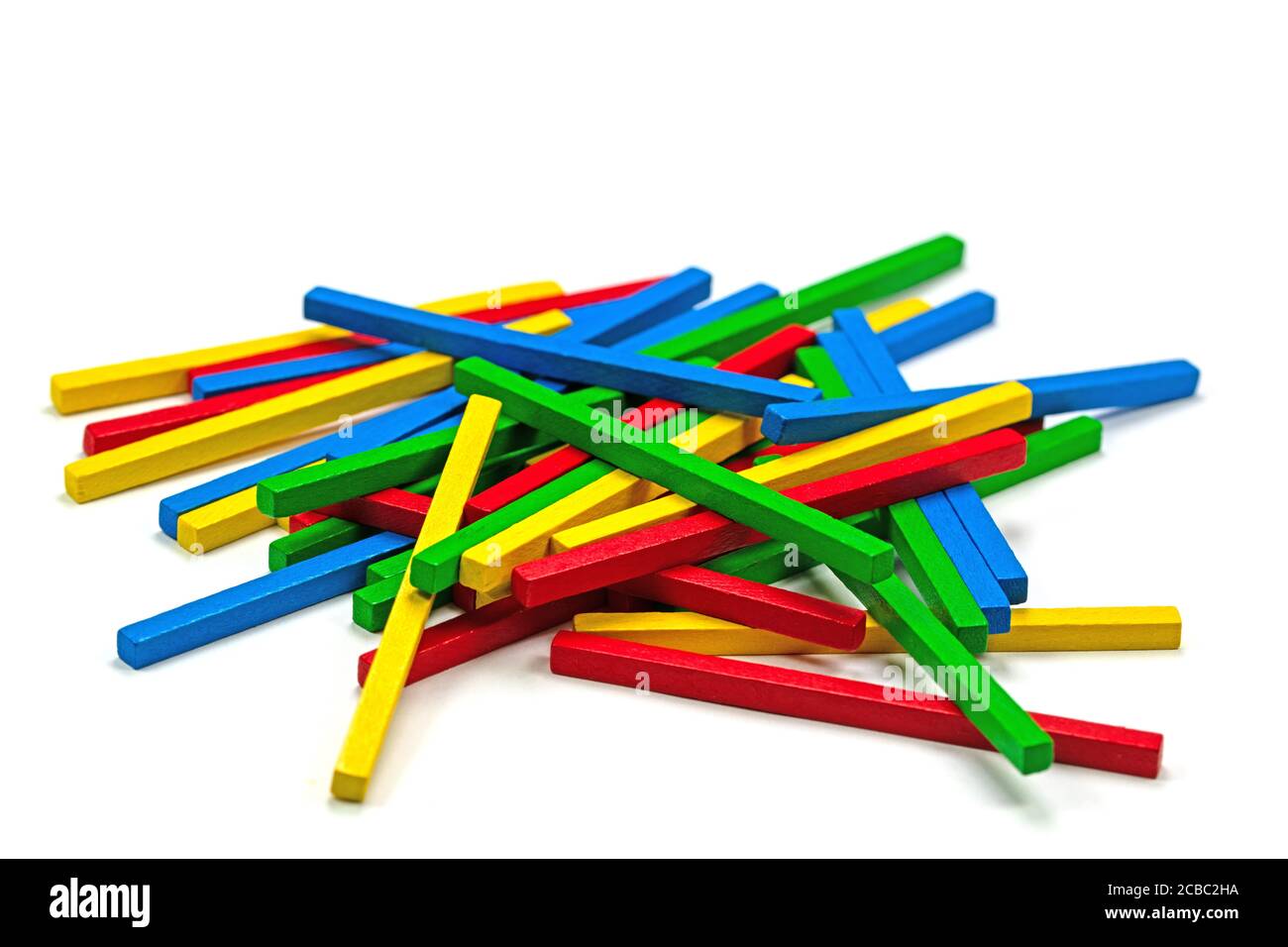 Colorful wooden sticks against a white background Stock Photo - Alamy