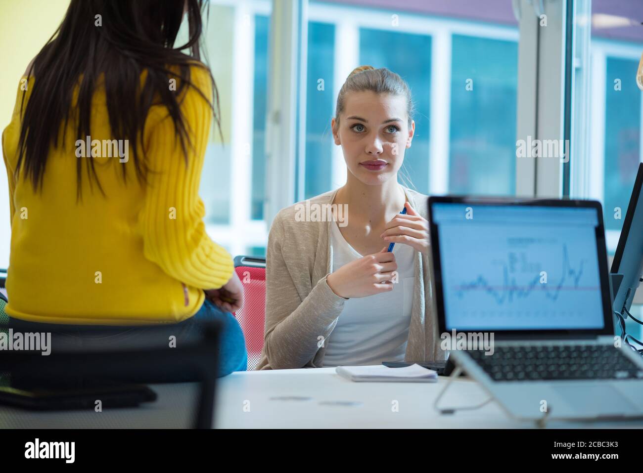 Two 40s diverse women talking hi-res stock photography and images - Alamy