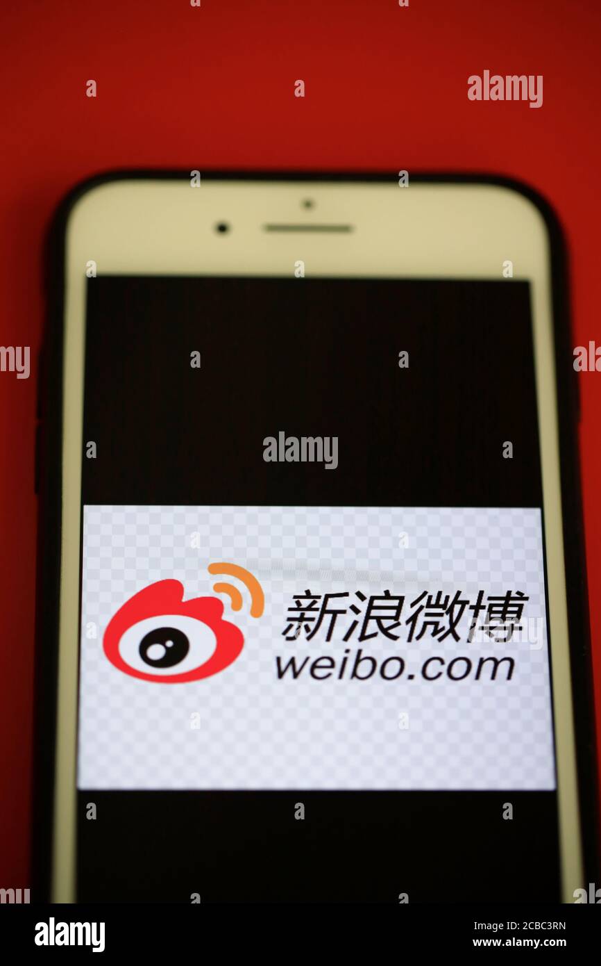 The logo of Sina Weibo/Weibo a Chinese microblogging social media platform on an iPhone screen ...