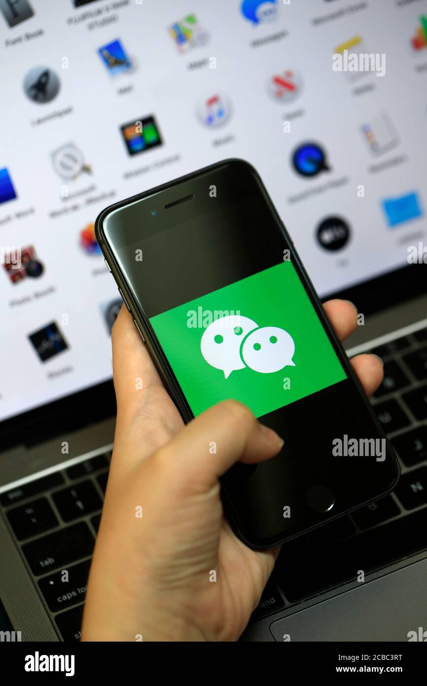 Wechat logo on a phone hi-res stock photography and images - Alamy