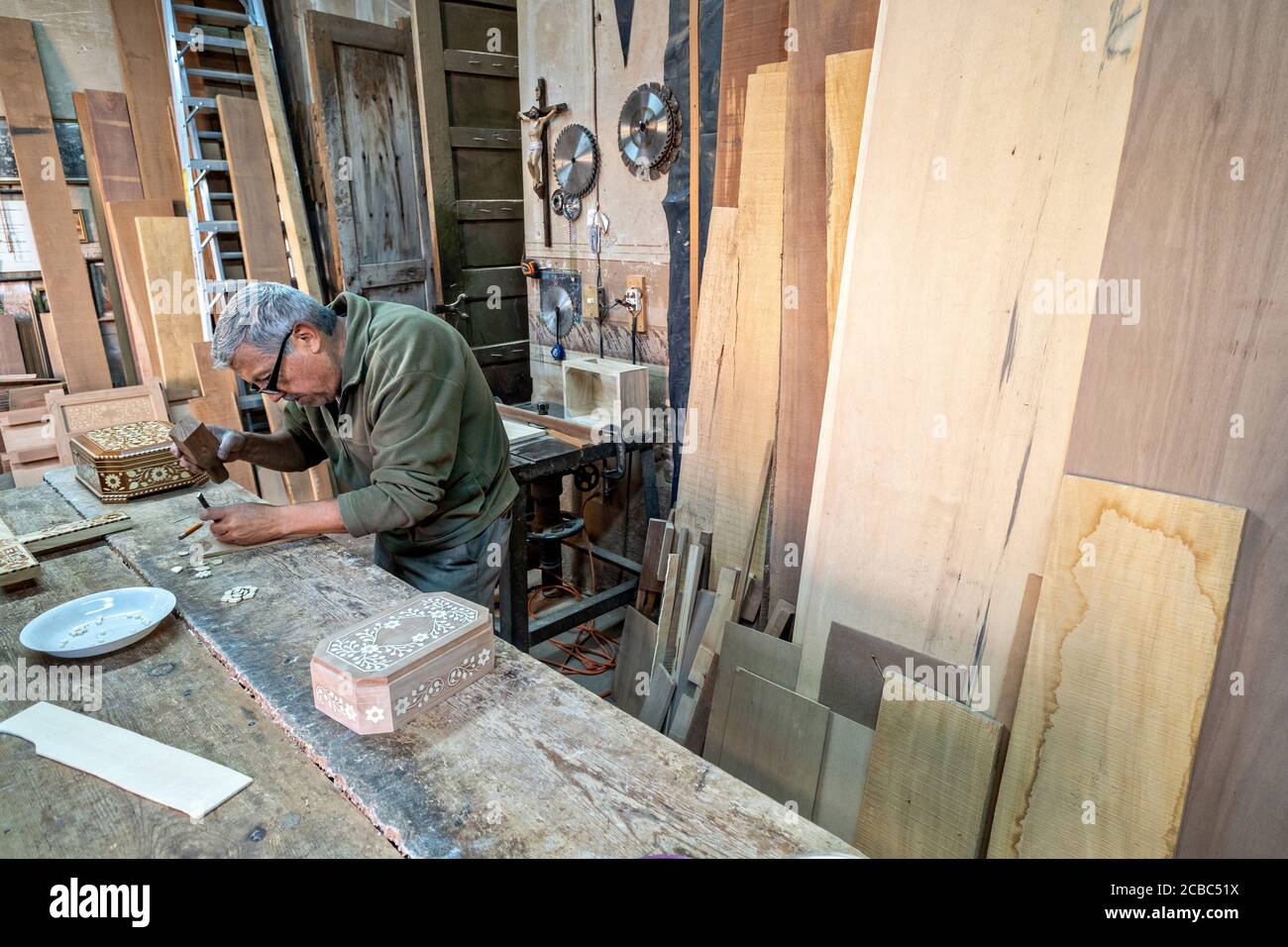 Mexican artist Francisco Aguirre creates inlaid wood designs at his ...