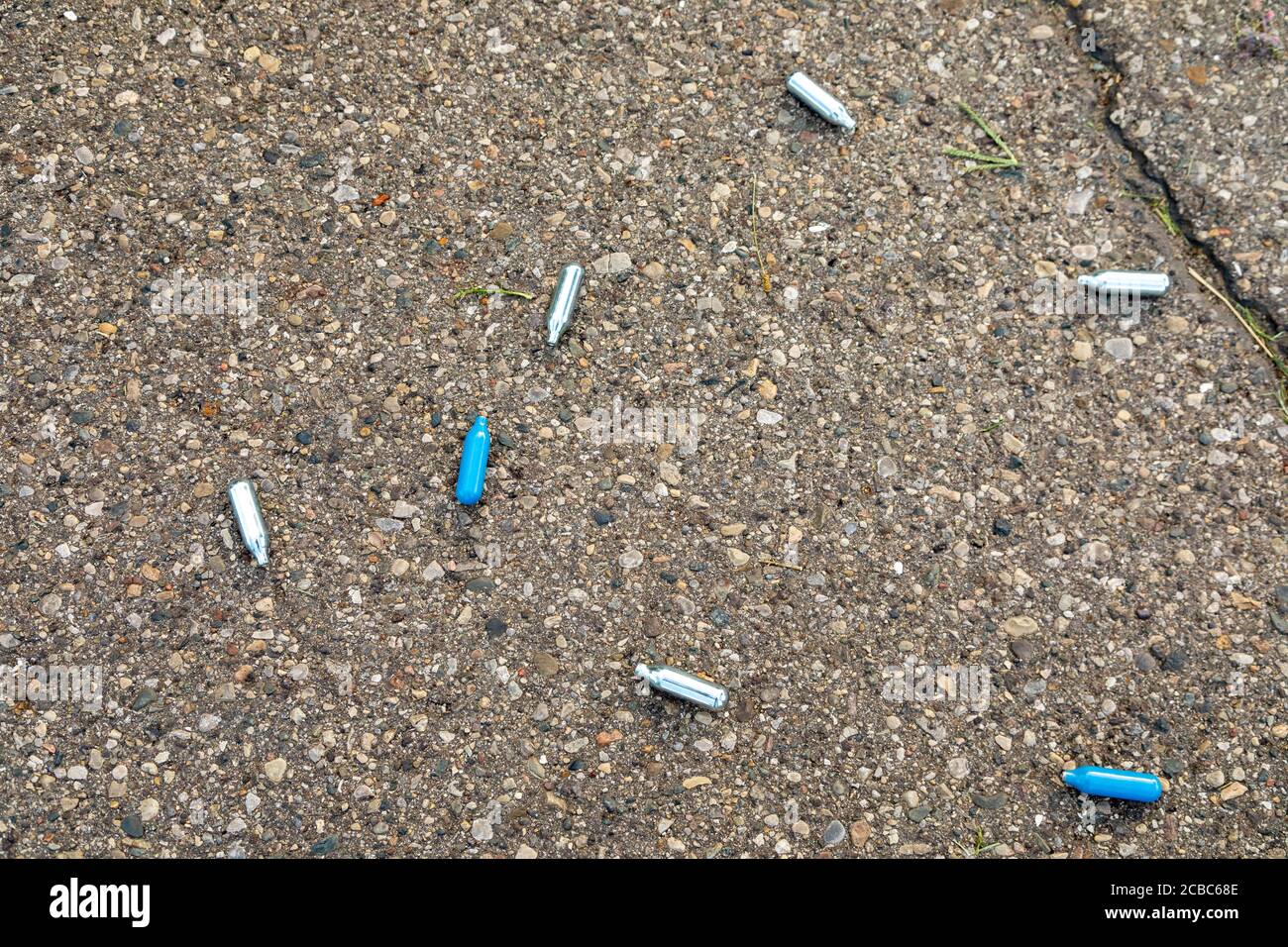 Detroit, Michigan - Discarded nitrous oxide (n2o) cannisters litter the ...