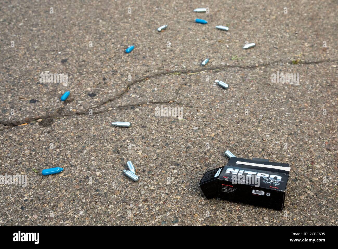 Detroit, Michigan - Discarded nitrous oxide (n2o) cannisters litter the ...