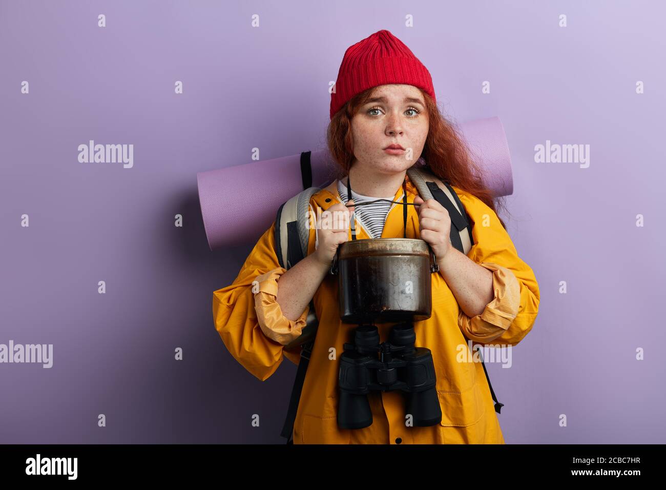 serious unhappy treveler isn't satisfied with weather during holiday ...