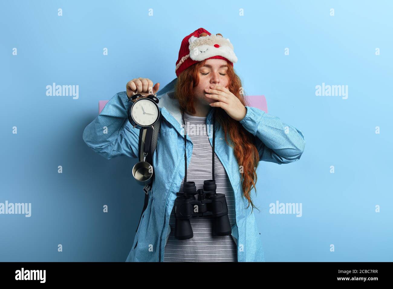 Backpacker yawning, feeling bored or tired after long travel. close up ...