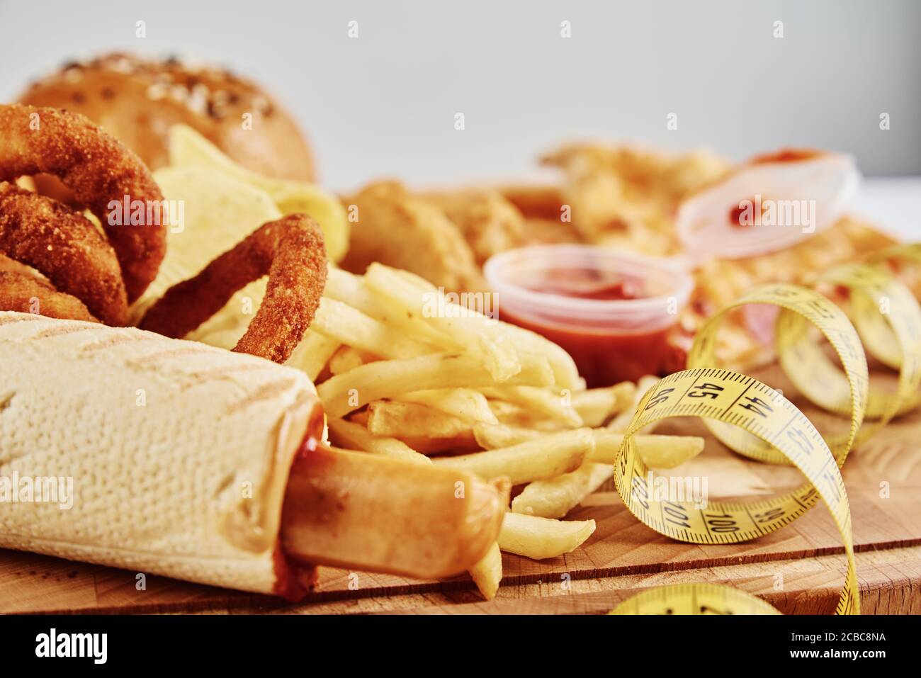 Unhealthy and junk food. Different types of fastfood and snacks on ...