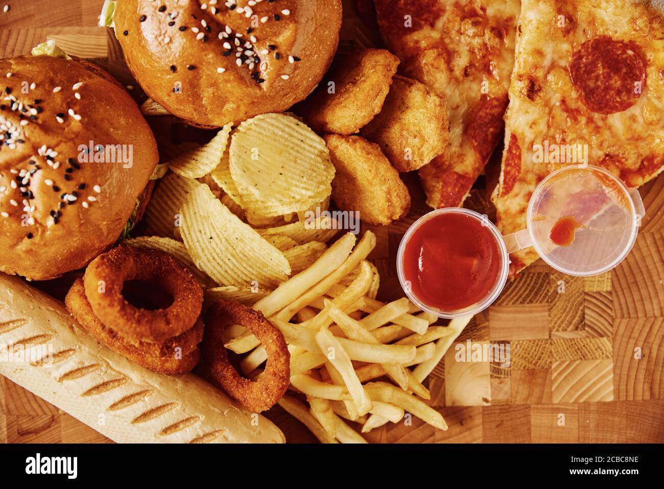 Unhealthy and junk food. Different types of fast food on the table ...